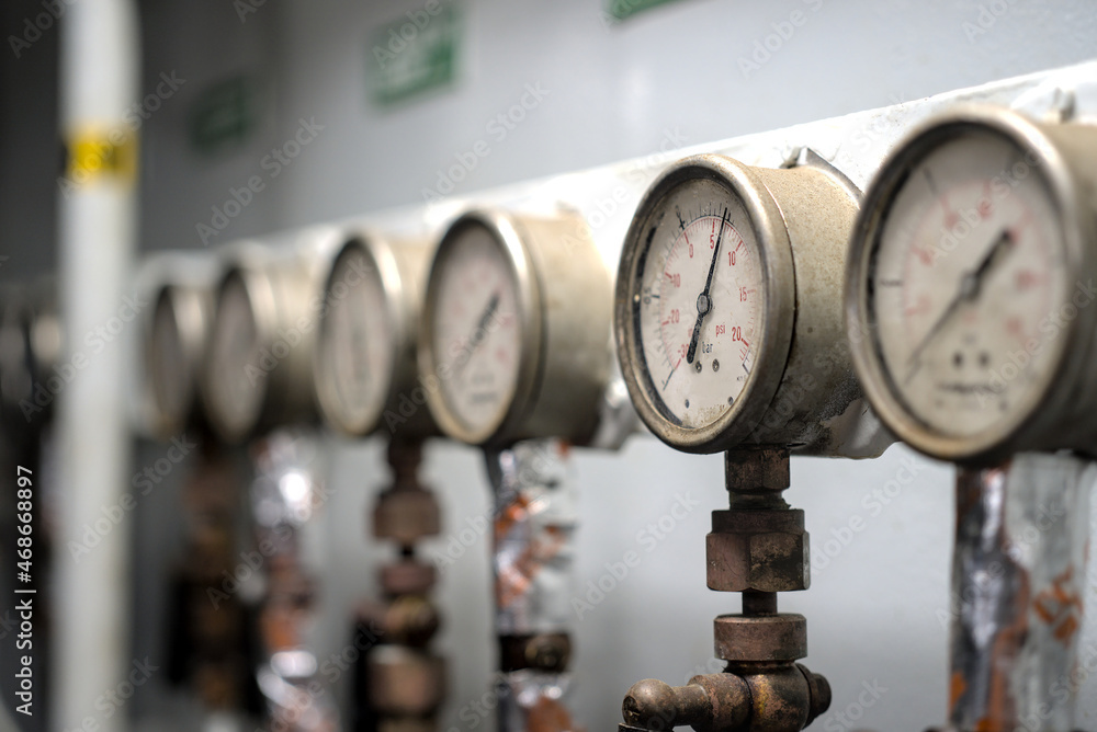 Pressure gauge psi meter in pipe and valves of water, oil and gas ...