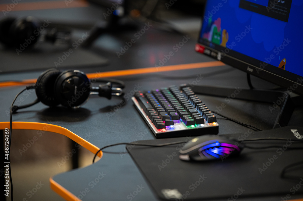 Focus on Hands, Keyboards and Mouse. Back view of young gamer playing ...