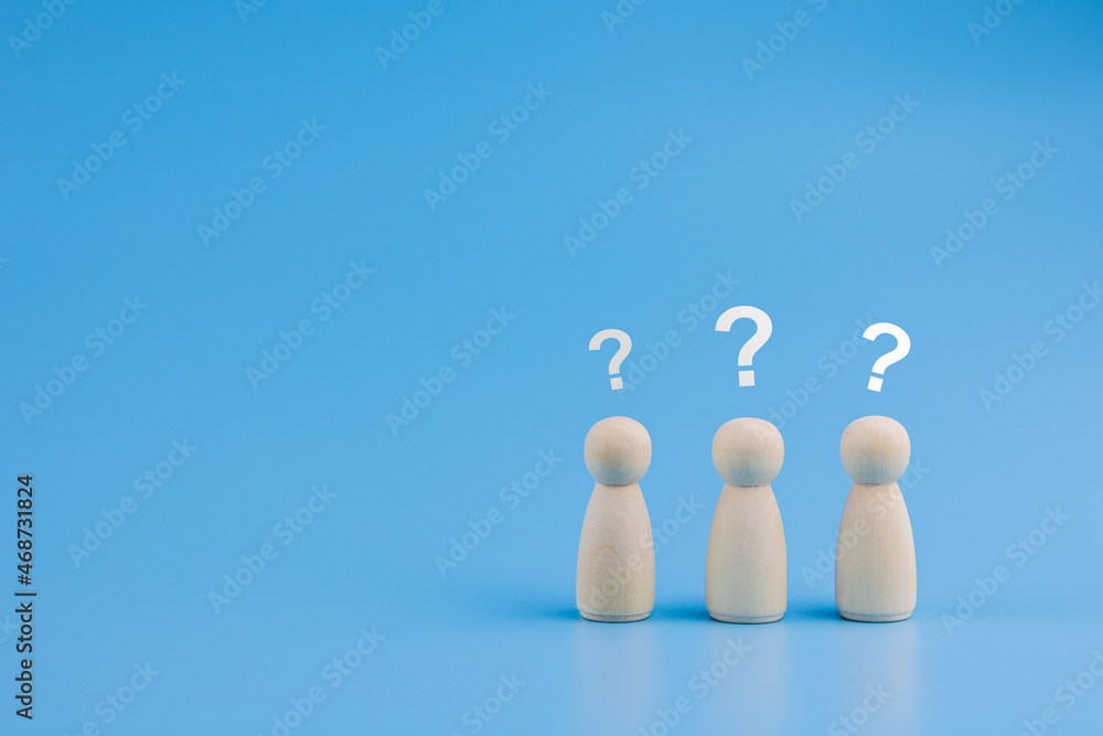 Human wooden block with question mark icon on blue background. concept ...