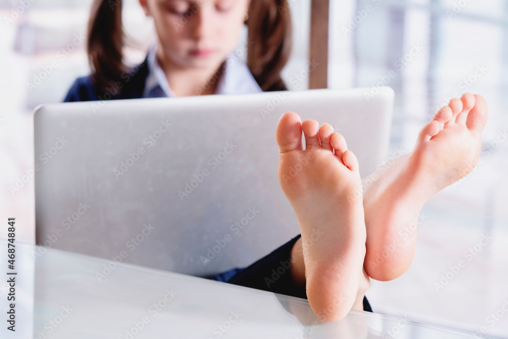 Humorous image of beautiful young business girl working in office with ...