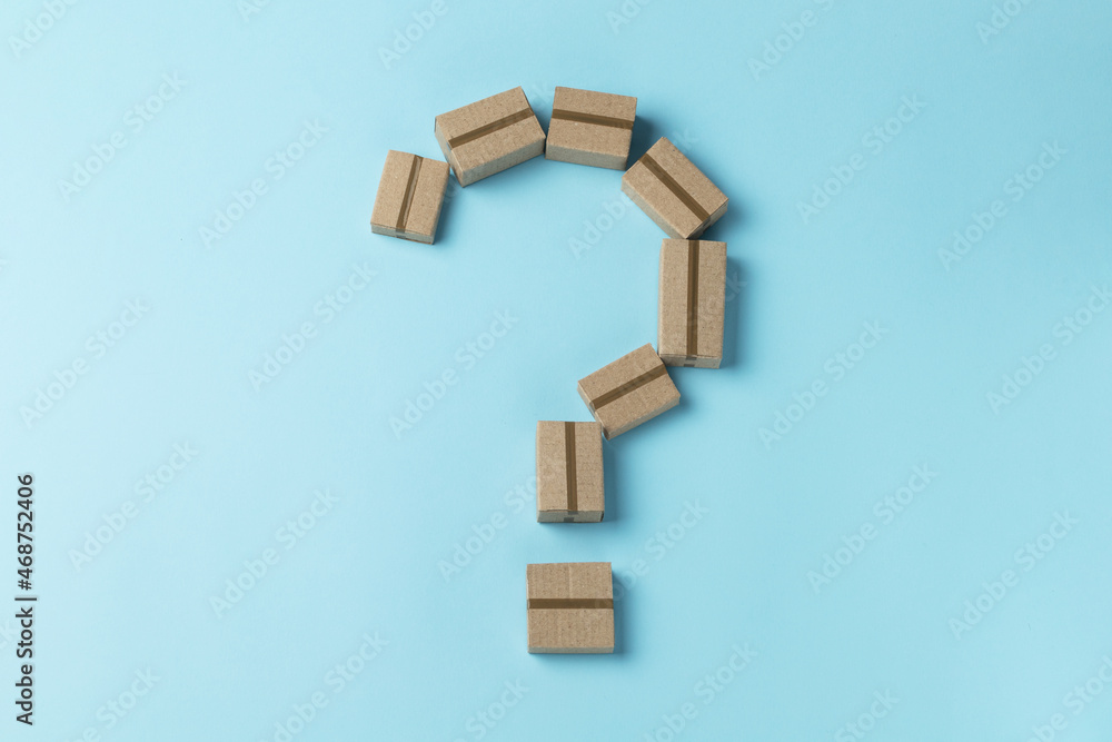 Question mark made from cardboard boxes on a blue background Stock ...