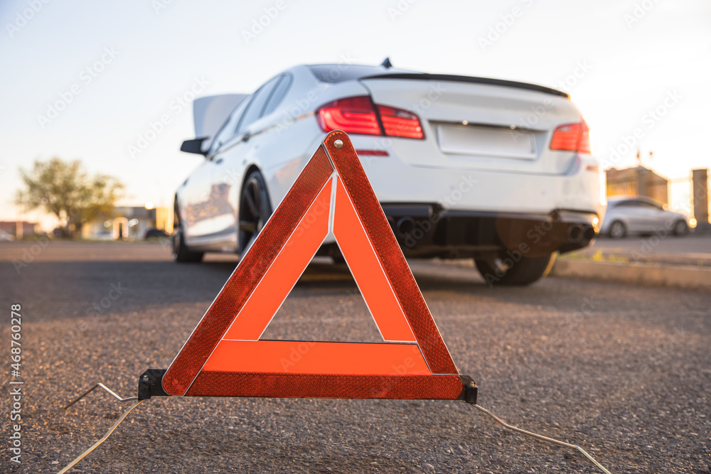 Red emergency stop sign and broken car Stock Photo | Adobe Stock