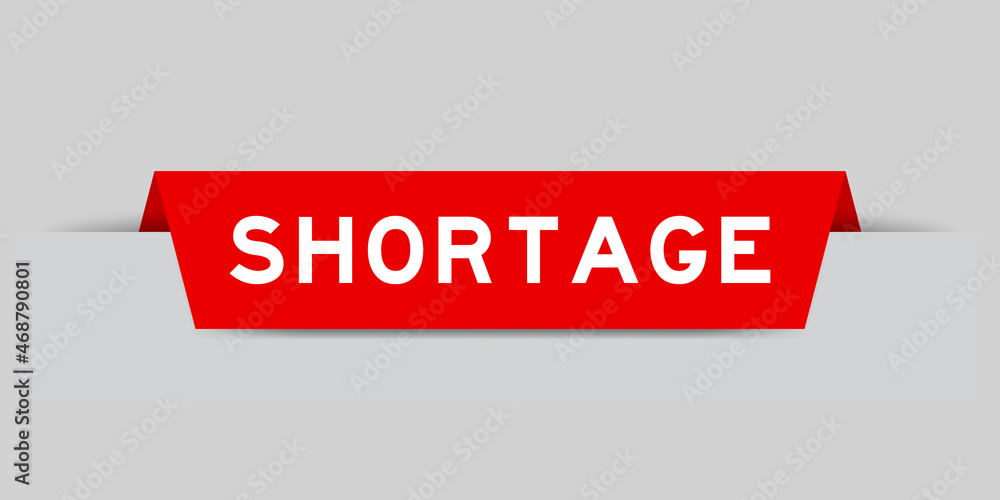 Red color inserted label with word shortage on gray background Stock ...