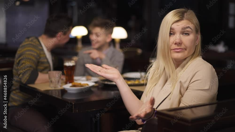 Portrait of embarrassed woman turning looking at camera gesturing as ...