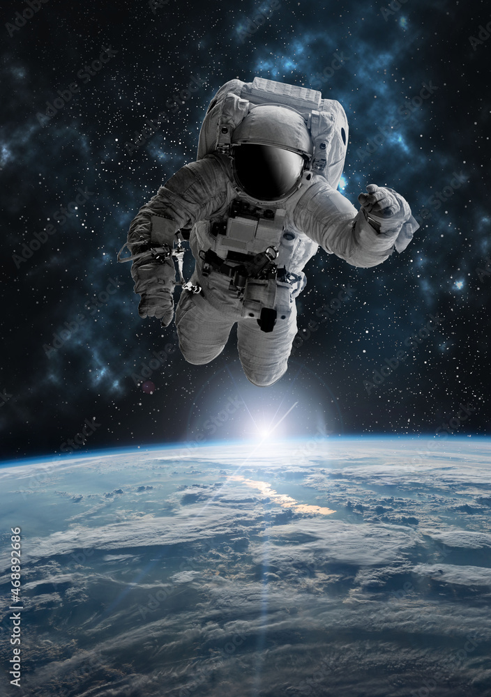 Astronaut in outer open space over the planet Earth.Stars provide the ...