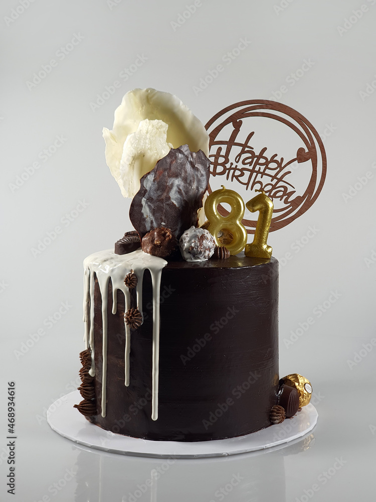 Chocolate cake with white chocolate ganache with custom make chocolate ...