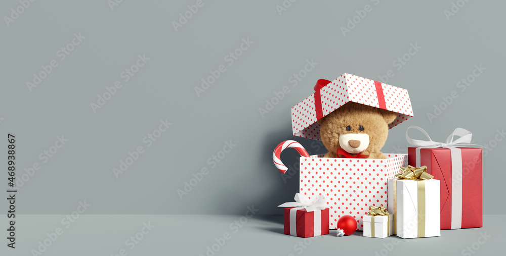 Surprise open gift box with teddy bear and candy cane inside. Christmas ...