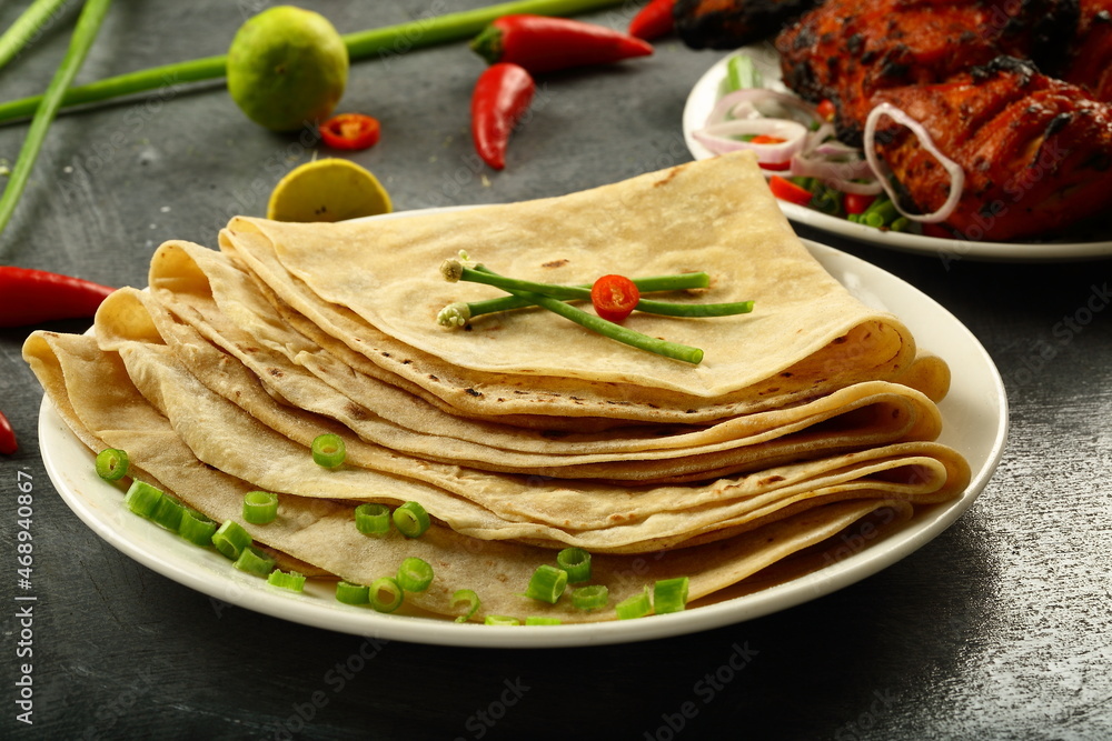 Arabic food cuisine- homemade roti, chapatti, served with tandoori ...