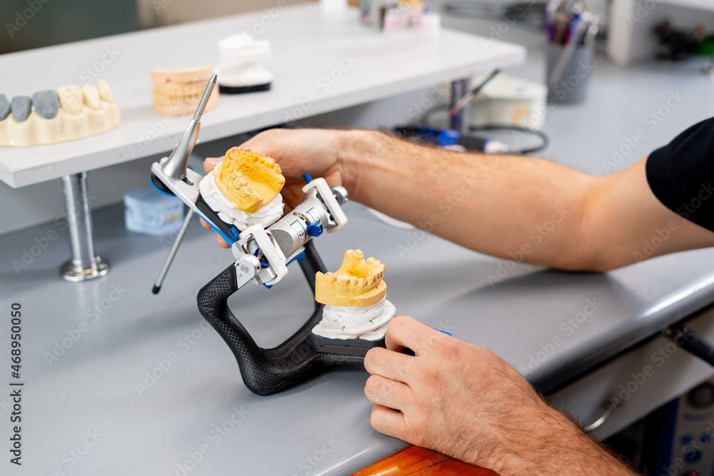 Process of creating teeth from ceramics and checking the size of the ...