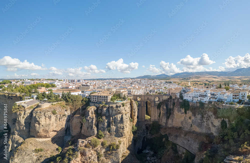 Aerial view at the full Ronda city, iconic New Bridge above the gauge ...