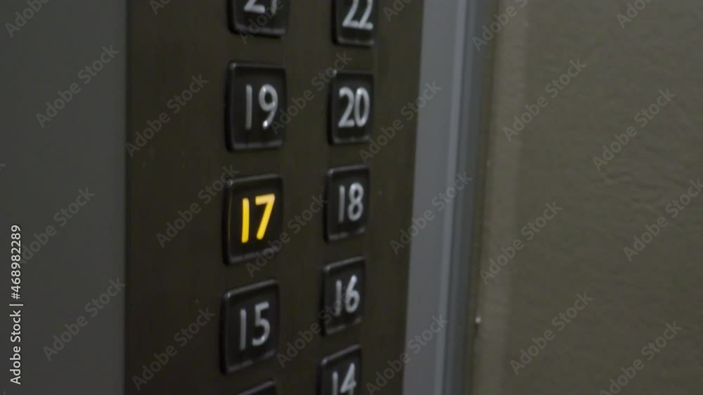 Push Elevator Button. Hand pressing lift button up to high floor of ...