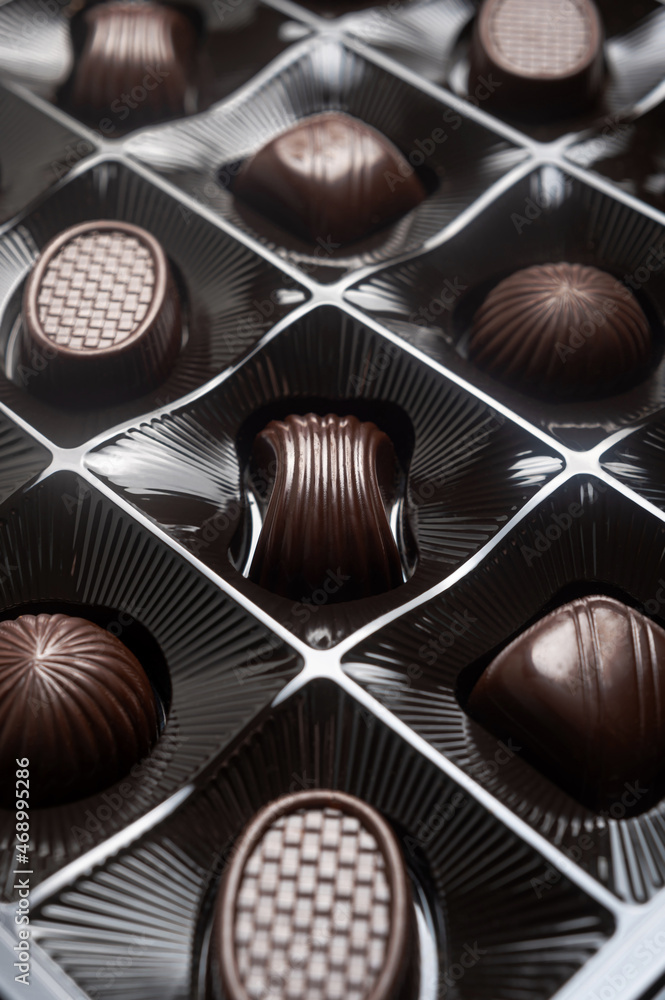 Dark bitter chocolate candies in a box. Stock Photo | Adobe Stock