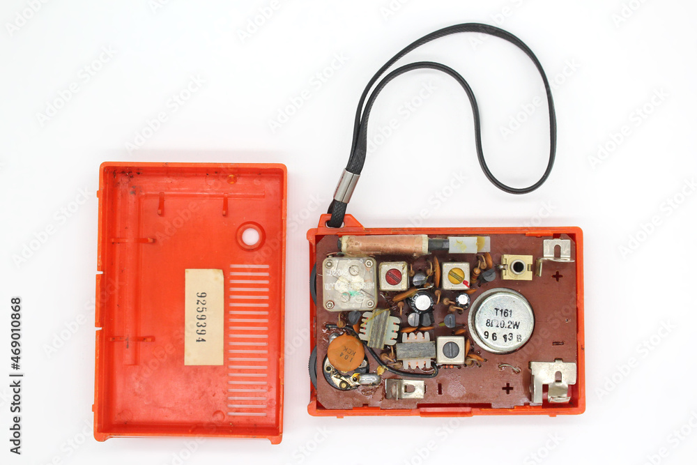 Vintage orange plastic transistor radio circuit board, isolated on a ...
