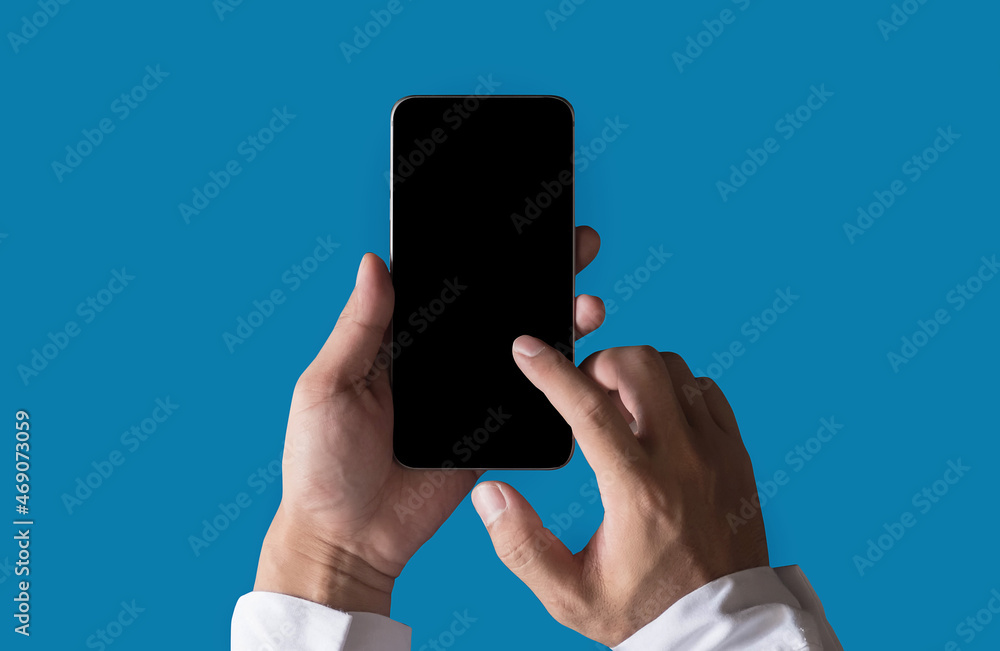 Hand holding mobile phone screen in background. Stock Photo | Adobe Stock