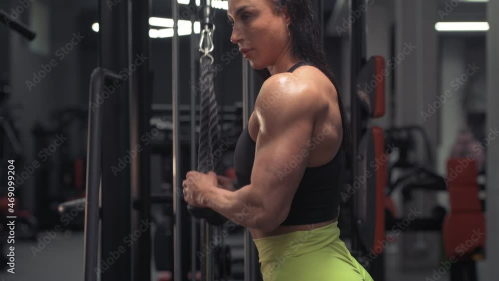 Muscular female bodybuilder woman workout arms: biceps and triceps in ...