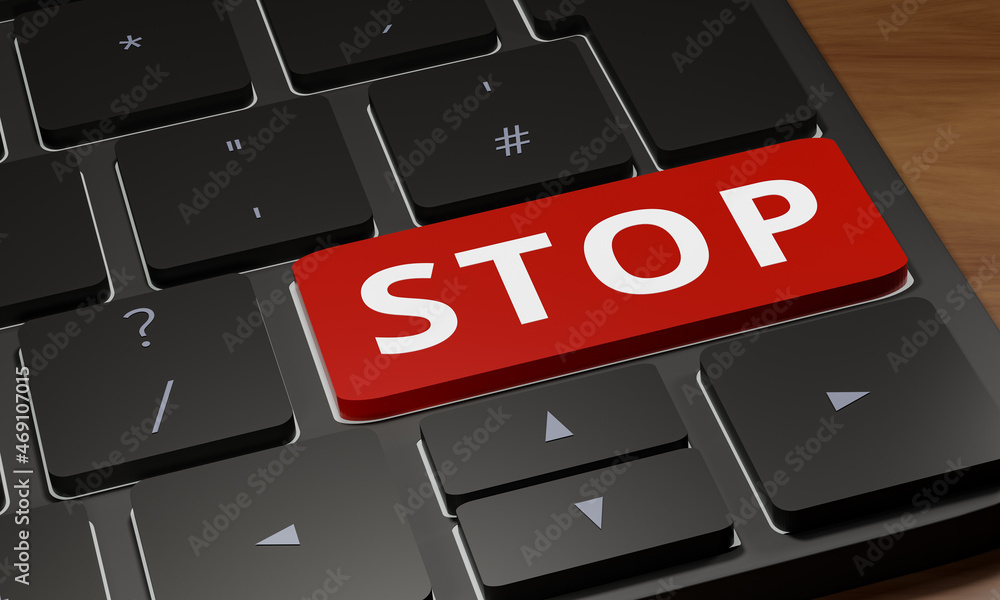 Keyboard stop button. Dark grey computer keyboard with one key in red ...