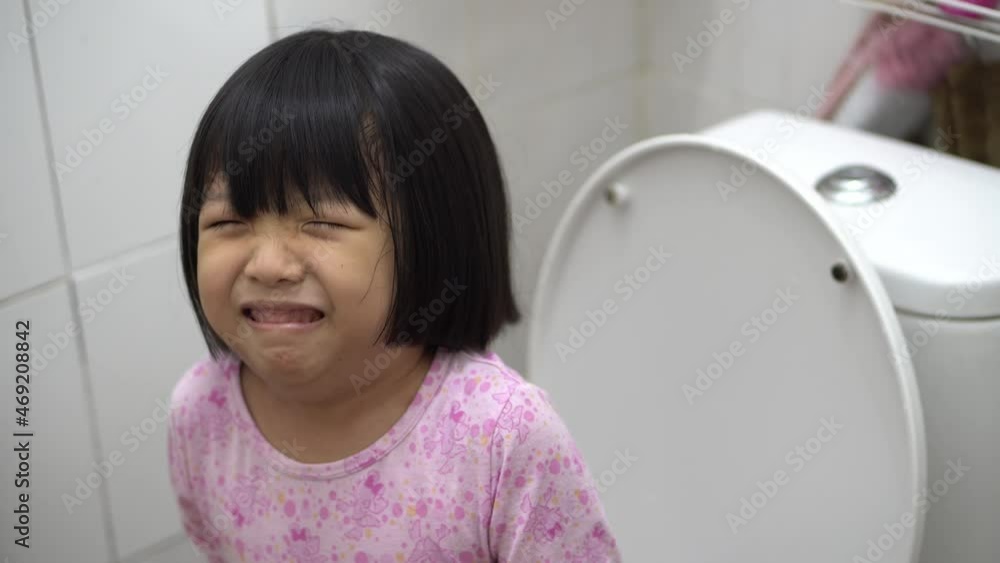 Chinese girl sitting in toilet suffer stomach ache or abdominal pain ...