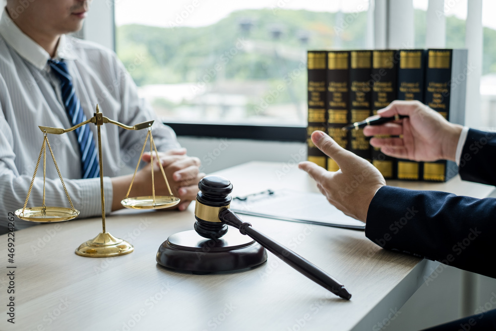 Male Lawyers Or A Judge Counseling Clients About Judicial Justice And