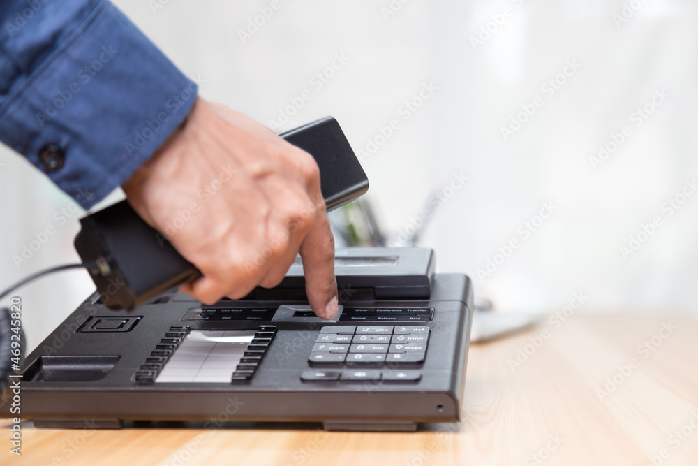 Foto Stock Call center staff man hand point to press the button number ...