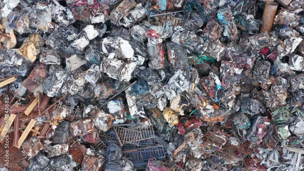 Scrap metal at a junkyard (wrecking yard) ready to be recycled ...