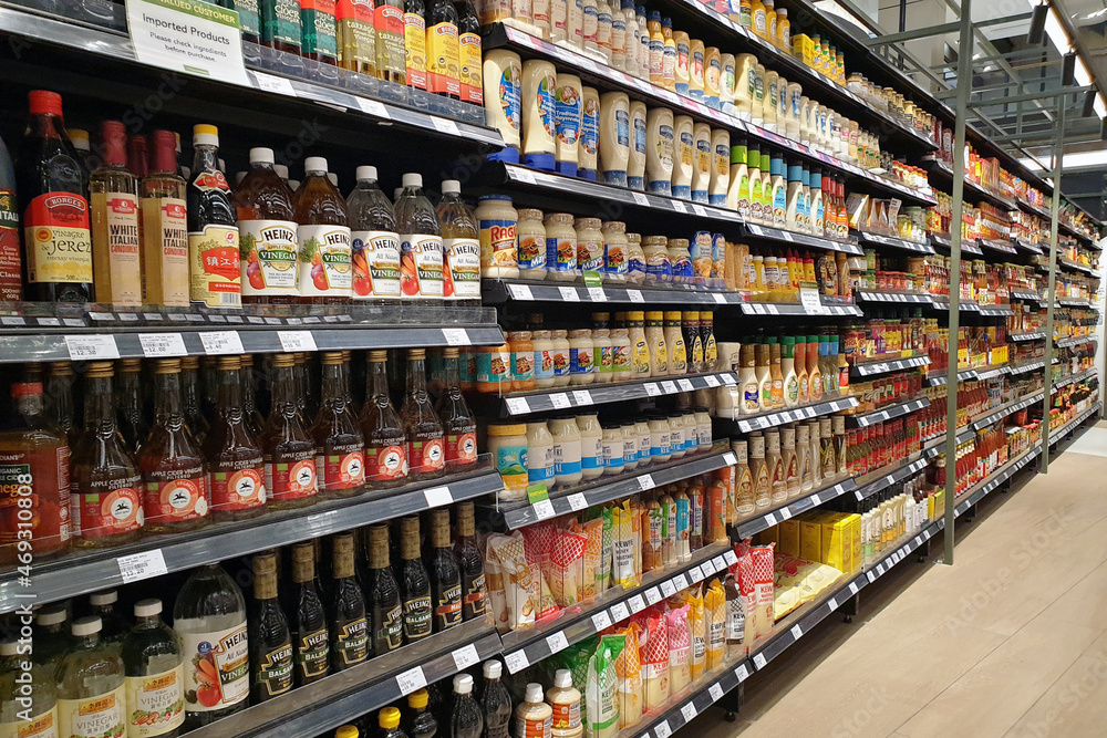 Interior view of Village Grocer with various cooking ingredients ...