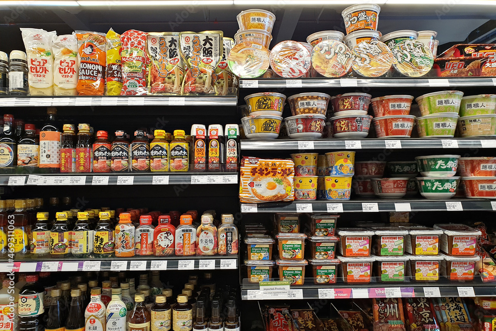 Various brands of Japan seasoning sauce, ramen and miso on display ...