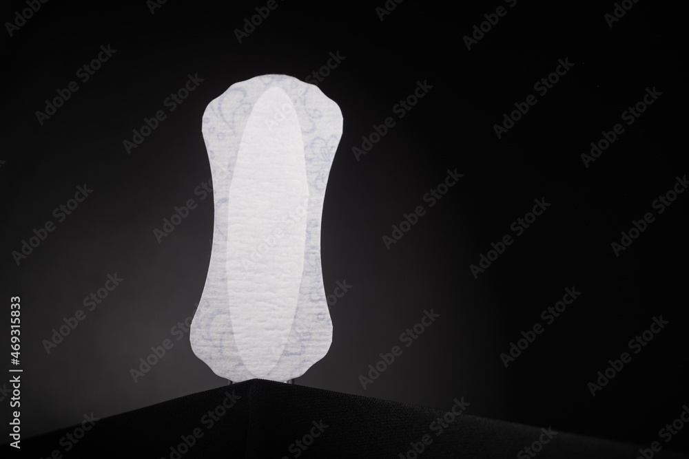 Intimate Hygiene Concept New White Panty Liner On Dark Table