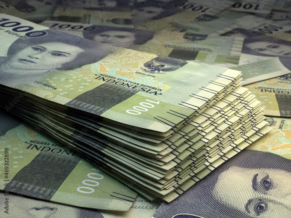 Indonesian money. Indonesian rupiah banknotes. 1000 IDR rupiahs bills ...