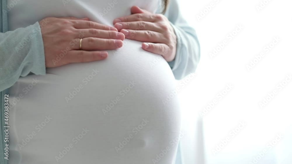 4k Pregnant expectant mother caressing her belly. Woman hands touching ...