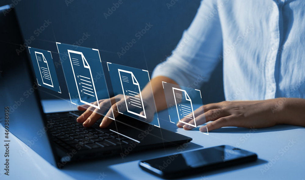 Business Woman working at laptop computer and digital documents with ...