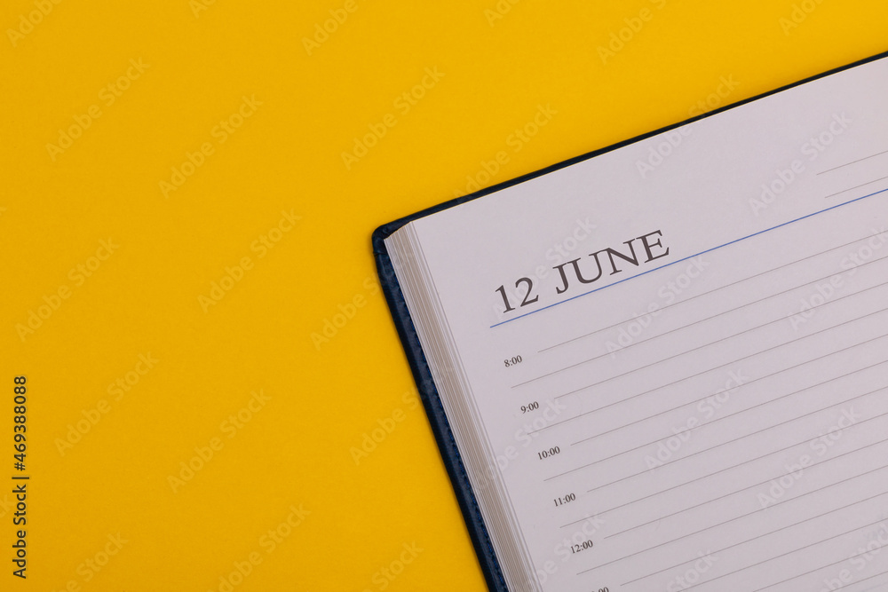 Notepad or diary with the exact date on a yellow background. Calendar ...