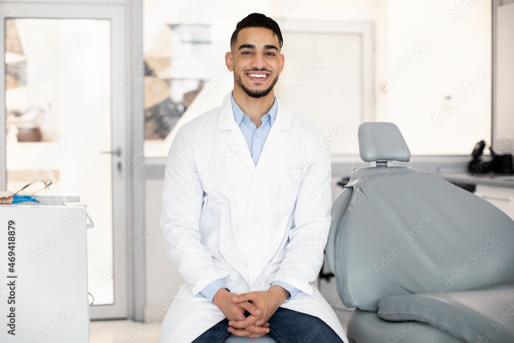 Stomatological Services. Handsome Arab Male Dentist Posing At Workplace ...