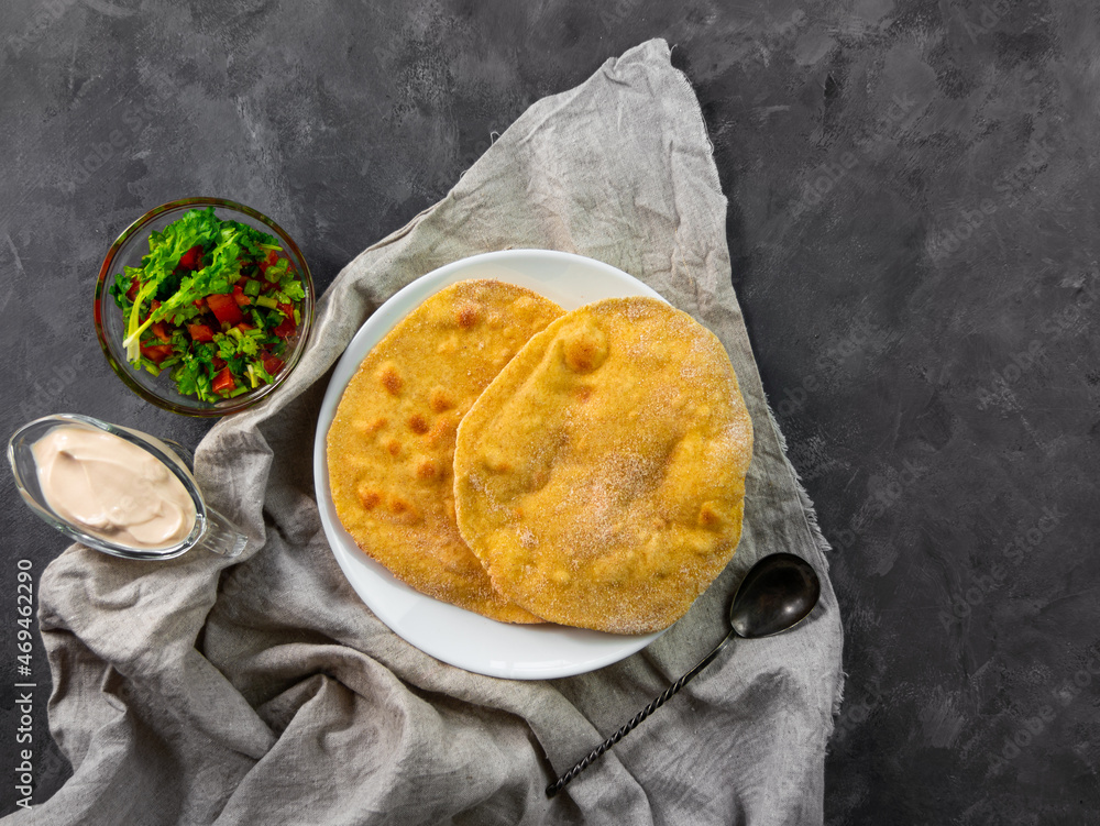 Homemade corn flatbread cilantro green tomato salsa linen cloth ...