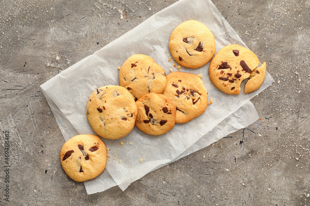 Parchment with delicious homemade cookies on grey background Stock ...