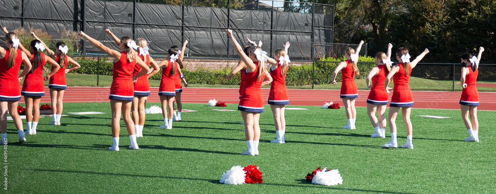 High school cheerleading squad practicing before homecoming Stock Photo ...