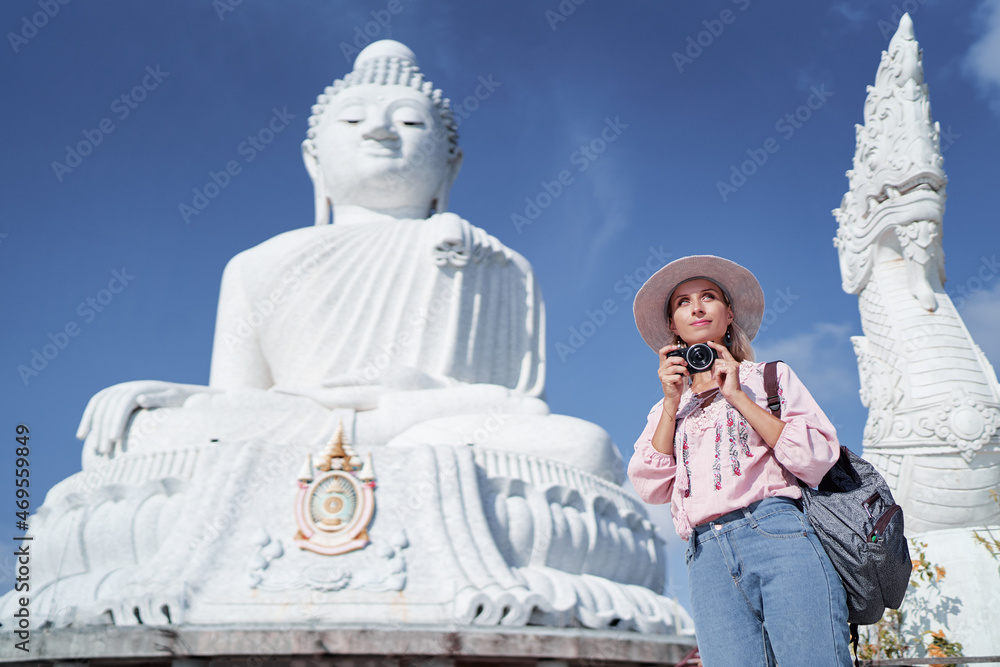 Traveling by Thailand. Pretty young woman taking photo in the Big ...