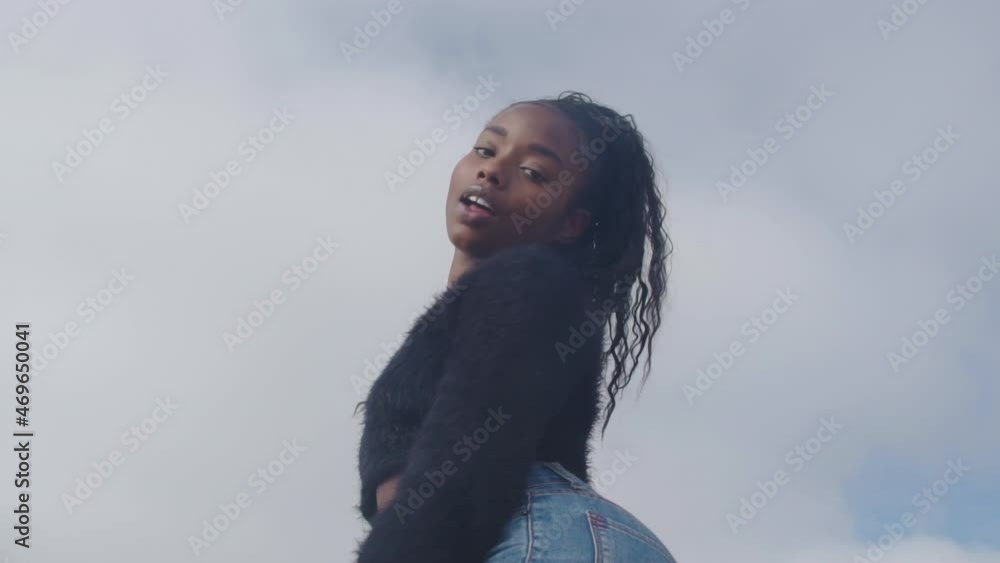 Young Dark Skinned Girl In Jeans Is Twerking On The Beach Attractive