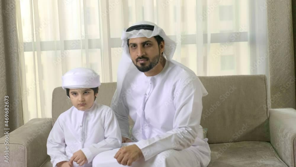 Arab family at home together. Happy Middle Eastern father and son ...