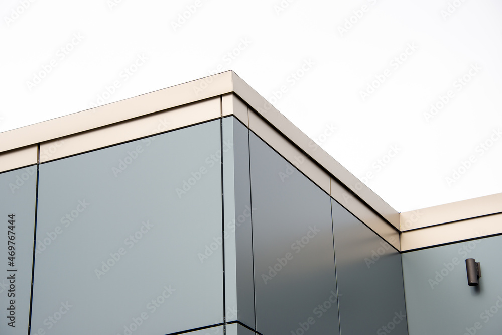 The exterior wall of a contemporary commercial style building with ...