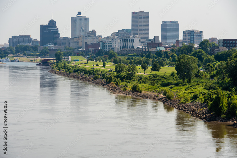 Memphis, TN cityscape reflecting on the water. View of green space ...