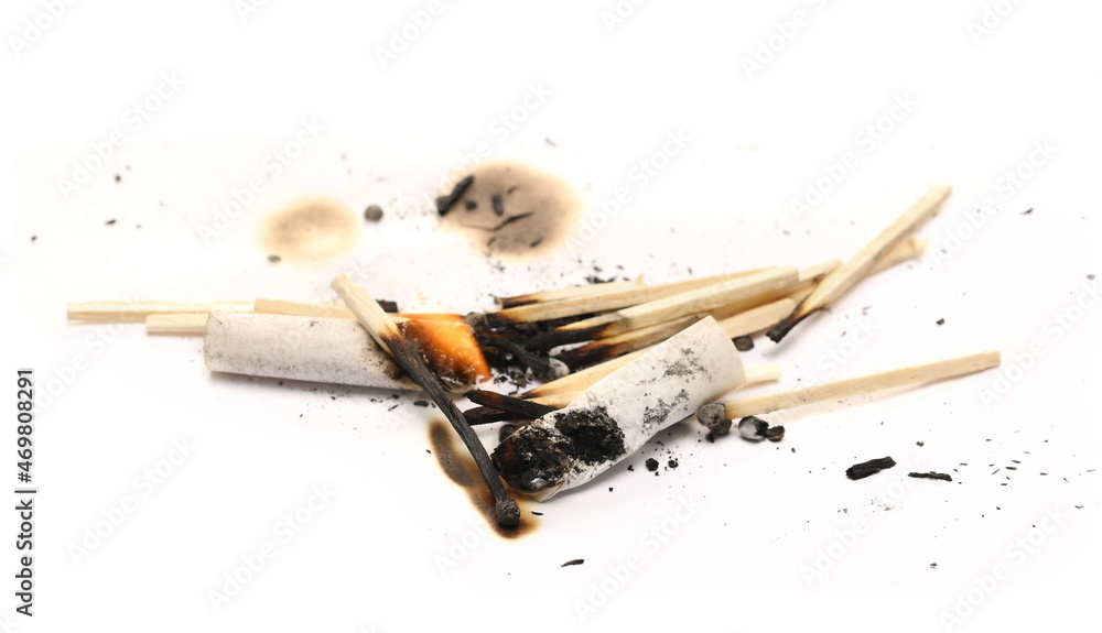 Cigarette butts, fire flame, safety match, stubs with ash pile ...
