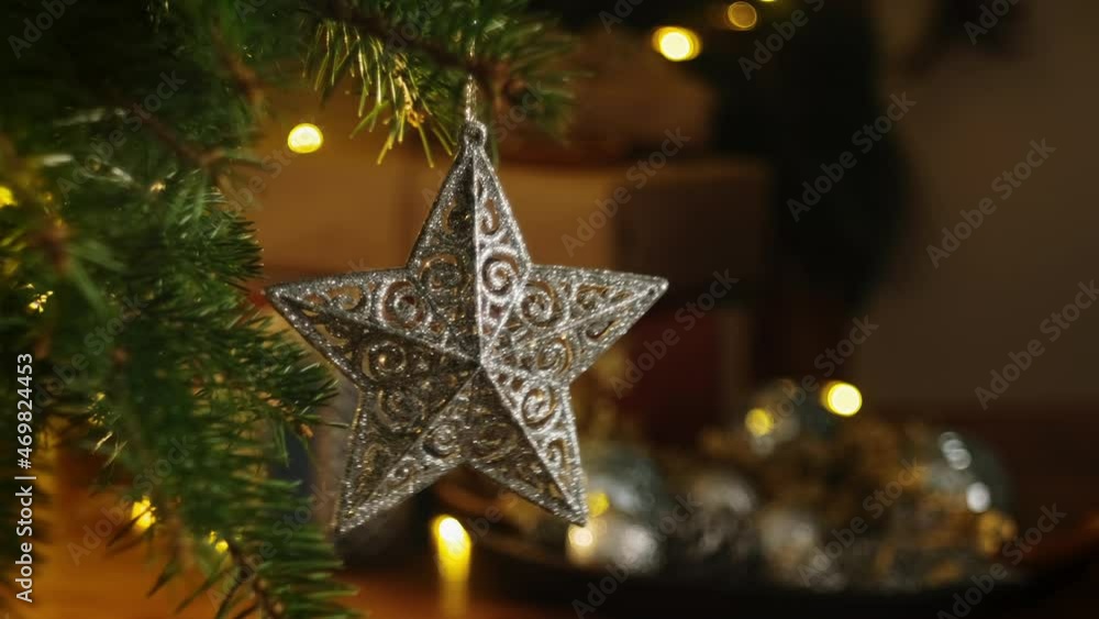 Christmas silver star decoration on tree branch at home. Christmas ...