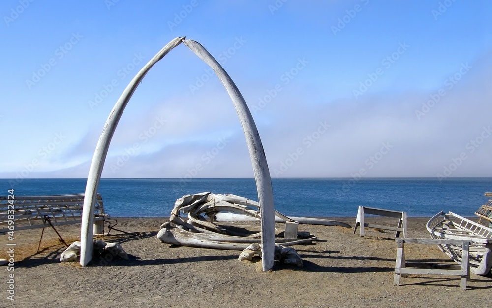 the iconic whale bone arch next to the arctic sea on a sunny summer day ...