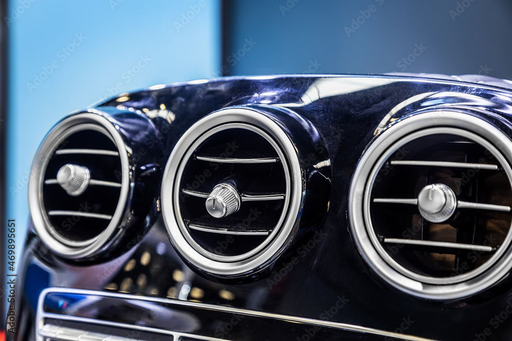 air ducts are round on the central panel of the sports car Stock Photo ...