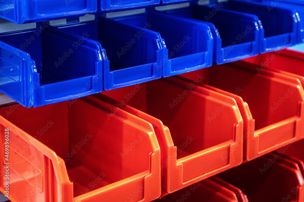 plastic boxes of different colors used in warehouses Stock Photo ...