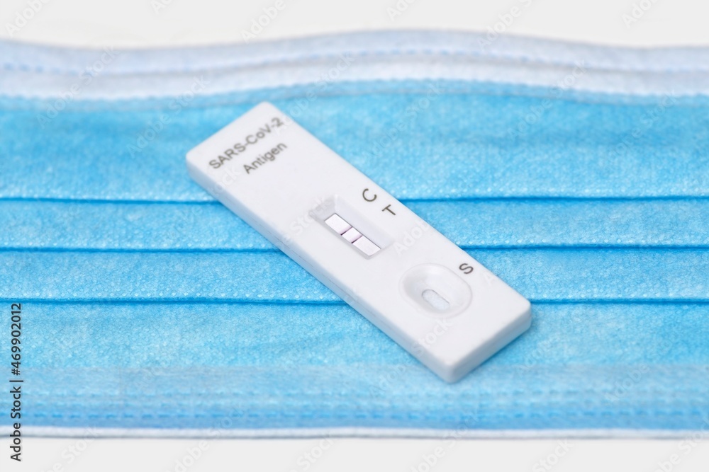 Covid-19 antigen self test lies on a anti virus protection mask. Stock ...