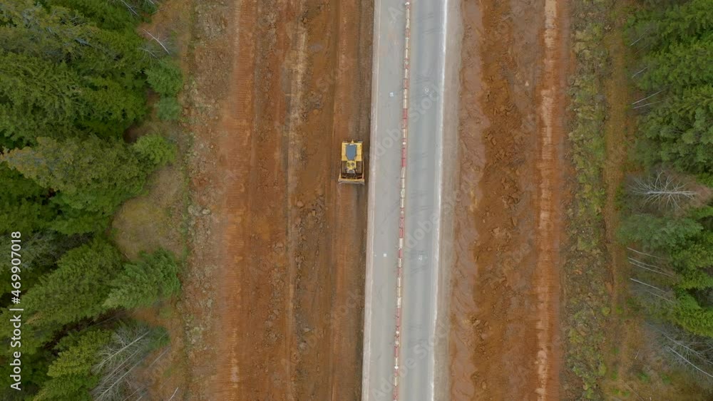 Vidéo Stock Crawler bulldozer levels ground, blade of heavy grader ...