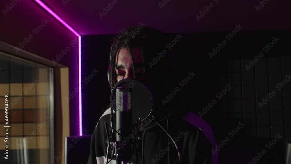 Portrait of inspired charismatic cool male hip hop artist with ...