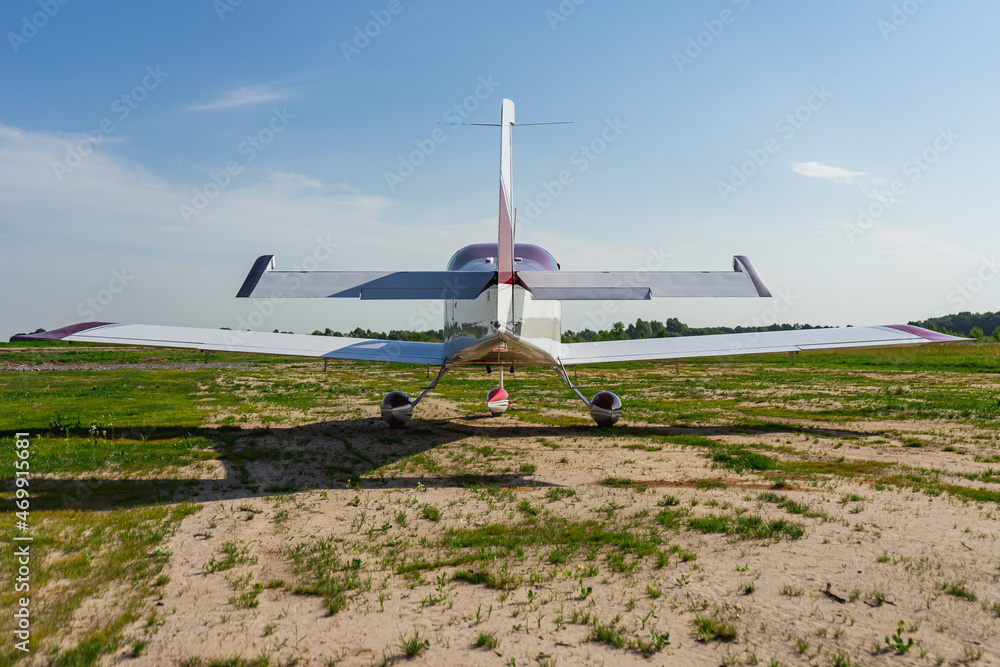 Small modern private jet before the flight against the backdrop of ...