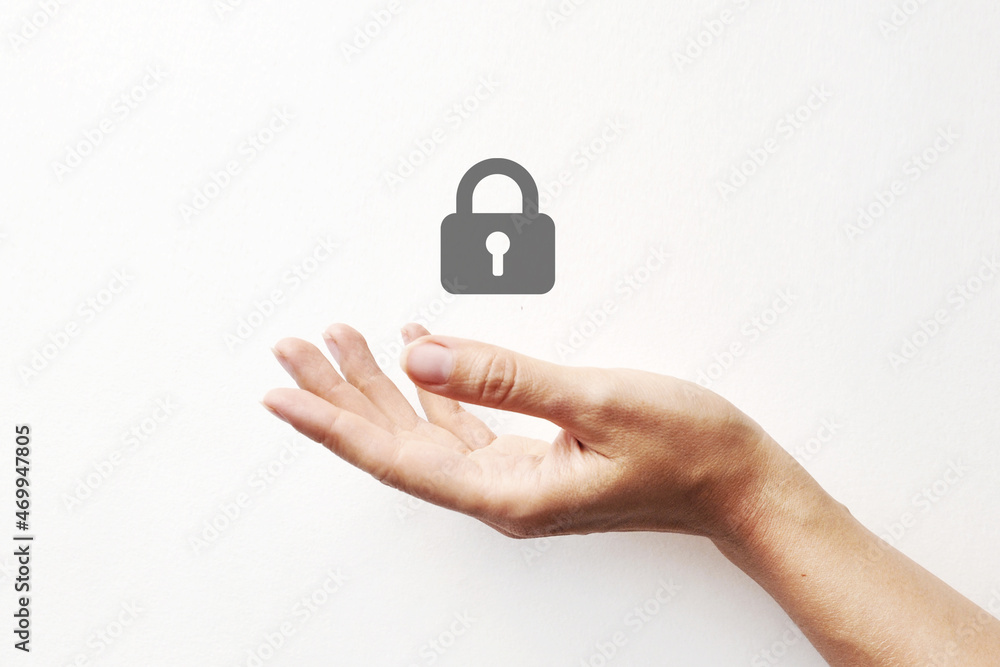 Image of a closed lock in the hand . Protection of personal information ...